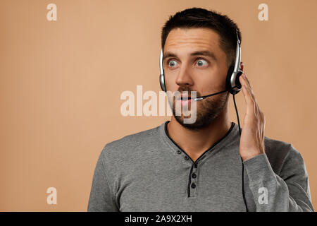 Surprised businessman man talk on mobile phone isolated on white copy ...