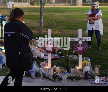 Residents gather during a community vigil on Monday, June 30, 2025, to ...