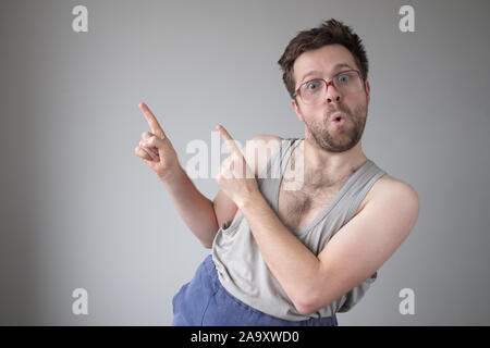 Man Pointing Finger Aside At Huge Phone Screen, Yellow Background Stock ...