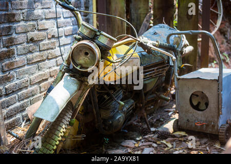 Old rusted abandoned motorcycle in desolate barn Stock Photo - Alamy