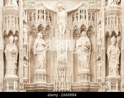 Reredos, of the crucifixion of Jesus Christ, behind the altar at a side ...