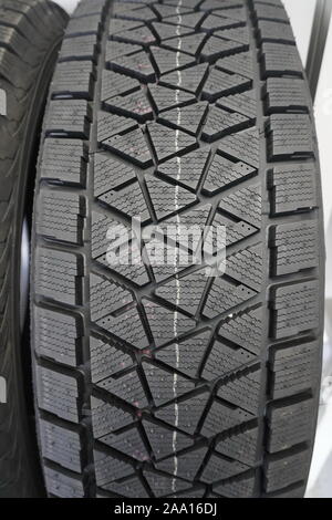 Tread patterns of various Winter Tires, in tire store, black rubber ...