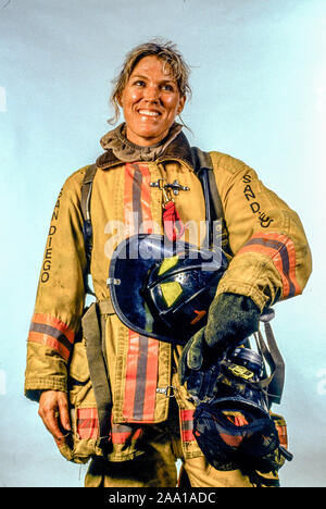 Firefighter Carrying an Woman to Safety Stock Photo - Alamy
