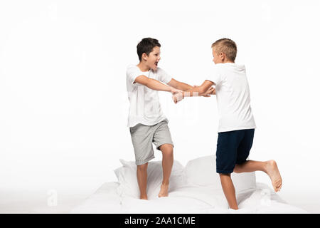 2 brothers fighting on a bed Stock Photo: 43420418 - Alamy