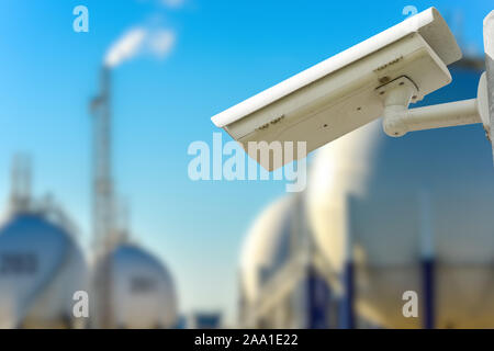 CCTV camera concept with refinery on blurry background Stock Photo - Alamy