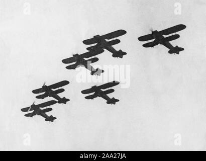 Military airplanes flying in V formation with grey and cloudy day at ...