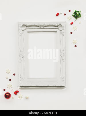 Christmas mock-up with white frame, cactus and Christmas balls on blue ...