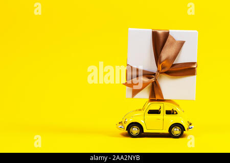 Vilnius, Lithuania - November 15, 2019: Yellow retro toy model car with ...