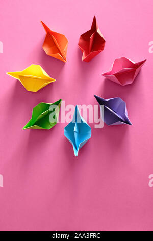 Color wheel origami on red background Stock Photo - Alamy
