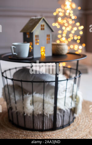 photo of two cups standing on a snow-covered table on the balcony in ...