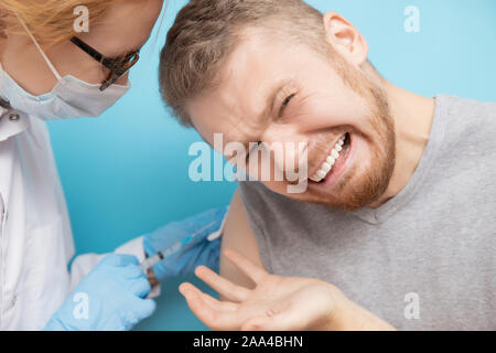 Man is fear and cries from syringe with vaccination doctor appointment ...