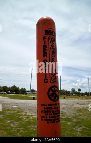 Warning sign for buried fiber optic cable in desert, New Mexico, USA ...