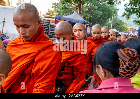 Monks Walk Down The Main Street In Pindaya Seeking Alms During The ...