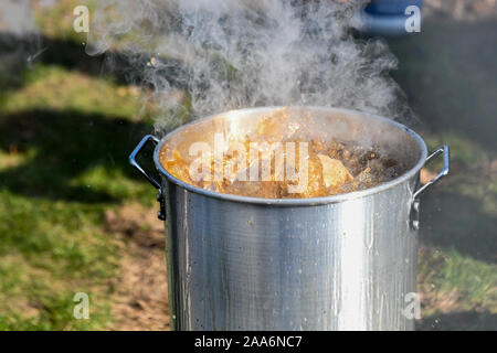 Boiling oil in a deep frier - hot oil - bubbling oil - steaming hot ...