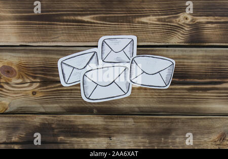 Paper sketched drawing with mail-themed letters on wooden Stock Photo ...