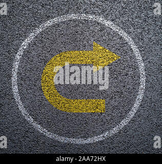 Yellow numbers and signs on the asphalt Stock Photo - Alamy