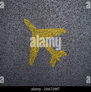 Yellow numbers and signs on the asphalt Stock Photo - Alamy