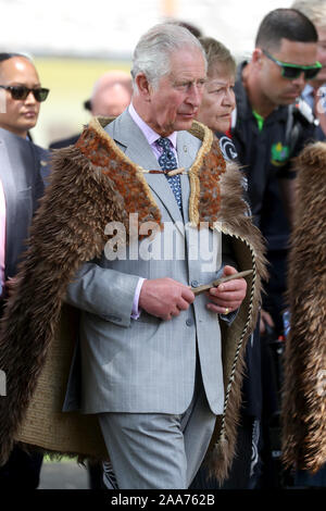 The Prince of Wales wearing a Maori cloak whilst watching a powhiri, a ...