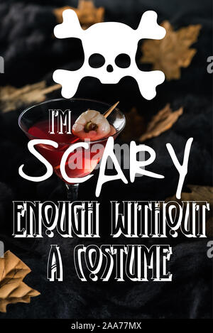 red decorated Halloween cocktail on black background with a wee bit ...