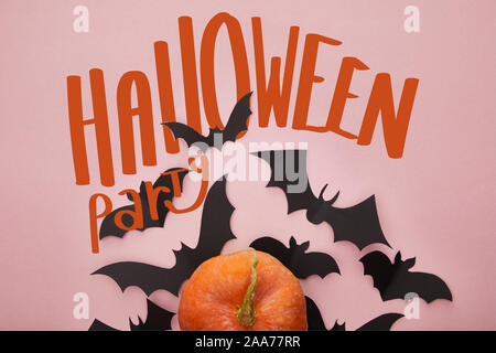 top view of paper black bats on white background with red happy ...