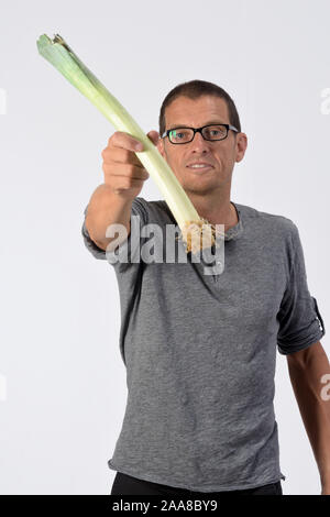 portrait of a man with leek on white background Stock Photo - Alamy