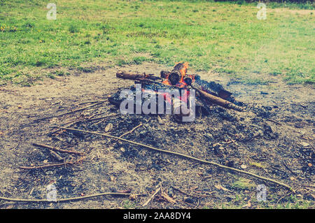 Rustic bonfire outdoors, vintage photo Stock Photo - Alamy