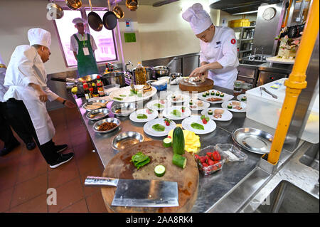 Kuala Lumpur, Malaysia. 20th Nov, 2019. Chefs make dishes during a ...