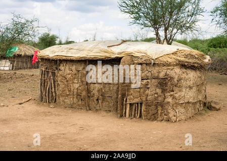 a traditional hut made from branches pasted with fresh cow-dung and mud ...