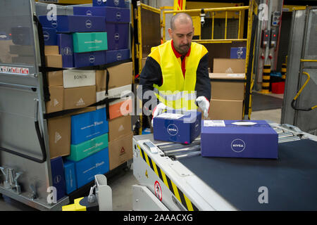 Interior view of the parcel center, parcels on the conveyor belt ...