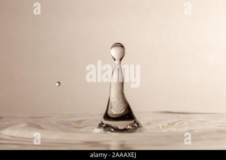 Water drops collision in sephia Stock Photo - Alamy