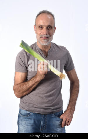 portrait of a man with leek on white background Stock Photo - Alamy