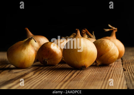 Small white french onions on a rusty metal table Stock Photo - Alamy
