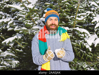 Macho with beard and mustache plays with snowball Stock Photo - Alamy