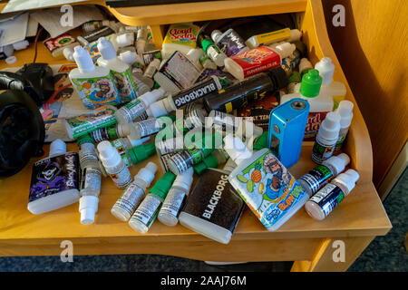 VAPING REFILLS LYING AROUND ON A DESK Stock Photo - Alamy