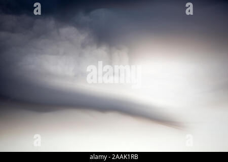 Weird shaped clouds over Ambleside at dusk, Lake District, UK Stock ...
