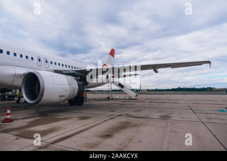 Jet propelled airplane during a boarding process at an aerodrome Stock ...