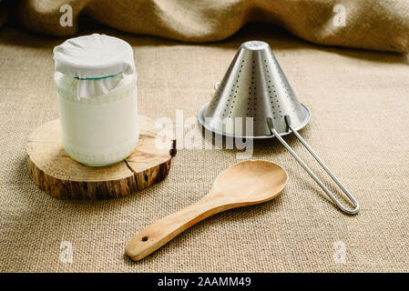 Preparation of a homemade milk kefir, separating the grains from the ...
