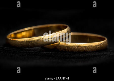 two worn golden rings on white Stock Photo - Alamy