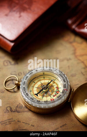 Old expedition map with compass, notebook, books and Panama hat Stock ...