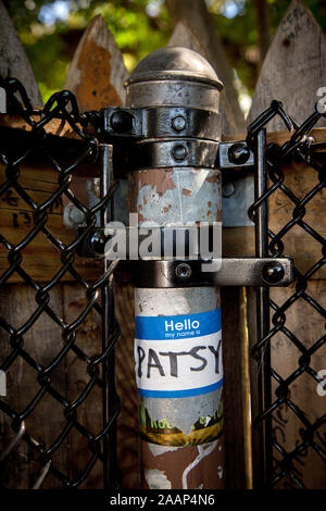 A visitor sticker with the text "Hello, My name is Patsy" on the wooden ...