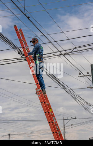 A utility pole with wires and ladder Stock Photo - Alamy