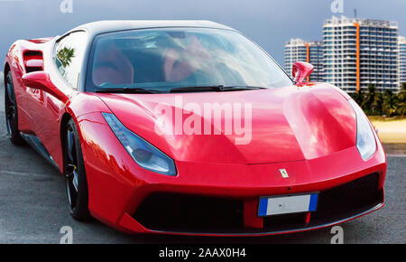 A Ferrari 488 GTB Front view with headlights on and turned wheel Stock ...