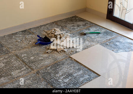 Breaking ceramic tiles, work in progress, maintenance Stock Photo - Alamy