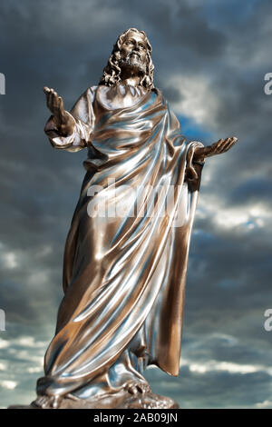 A small statue of a beckoning Jesus Christ Stock Photo - Alamy