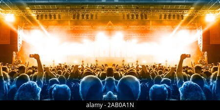 Concert crowd attending a huge gig Stock Photo - Alamy