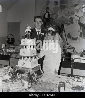 1960s, historical, a young just married couple, standing by their ...