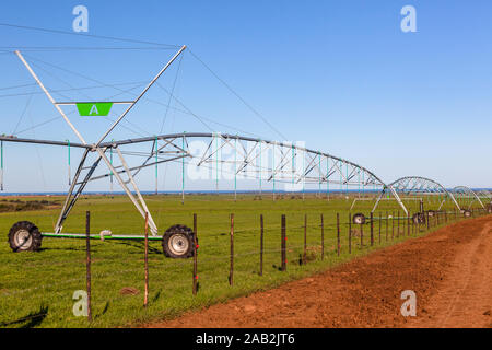Farming farm equipment with line of steel pipe mobile water sprinklers ...