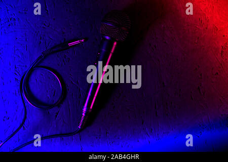 Singer lying on the floor with microphone Stock Photo - Alamy