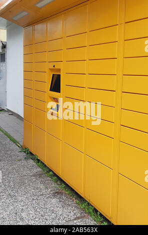 Self service storage cabinet for picking up a package in a city area ...