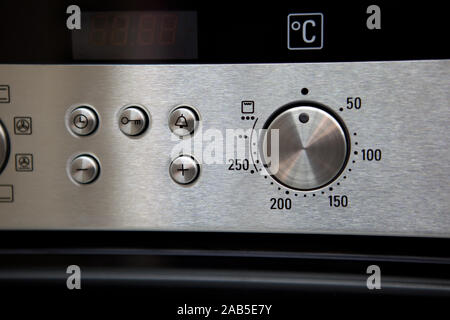 closeup of oven dashboard with grey buttons Stock Photo - Alamy